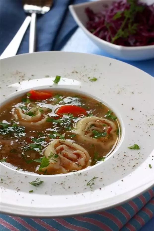 Hearty soup with onion rolls